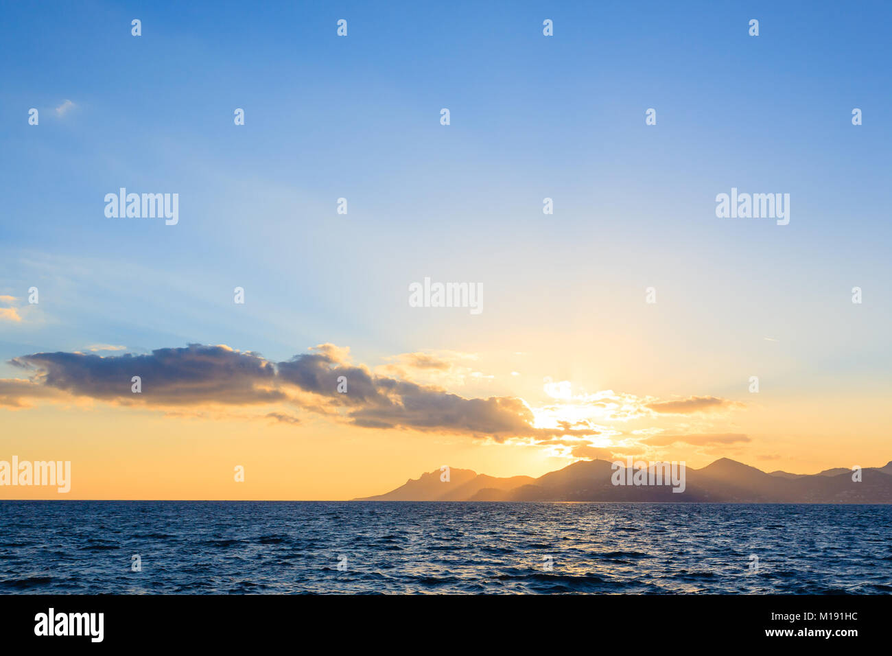 Sunset from the port of Cannes, France. Beautiful french panorama. Sun ...