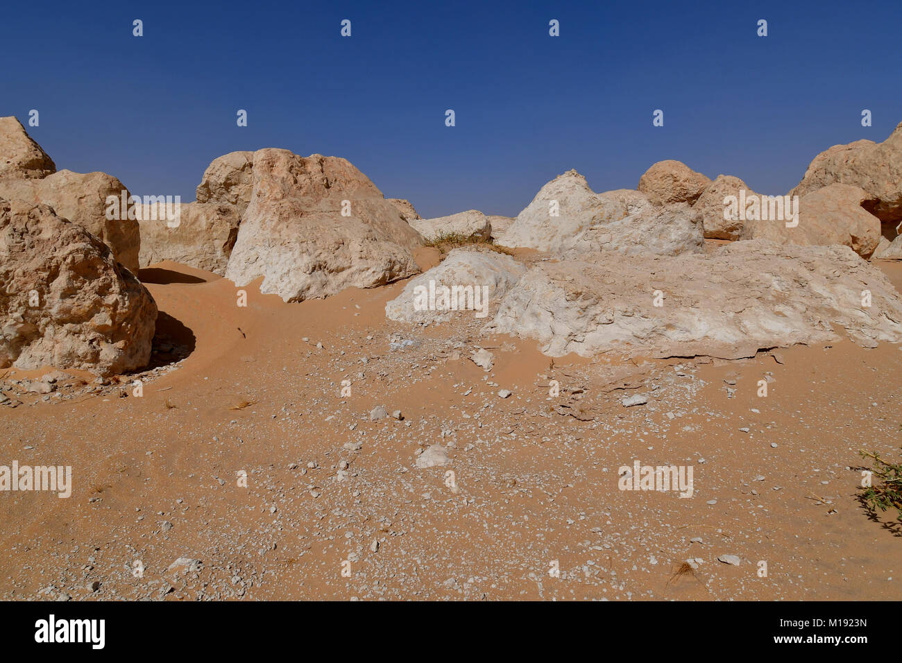 Desert scenery and landscape with desert sand and rocky formations ...