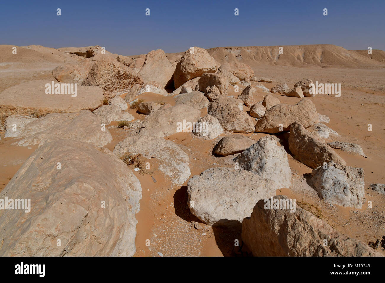 Desert scenery and landscape with desert sand and rocky formations ...