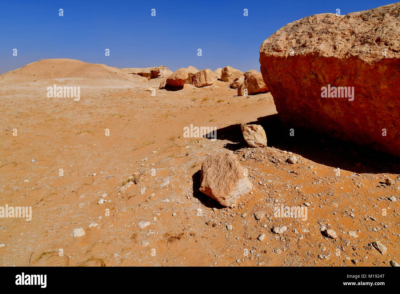 Desert scenery and landscape with desert sand and rocky formations ...
