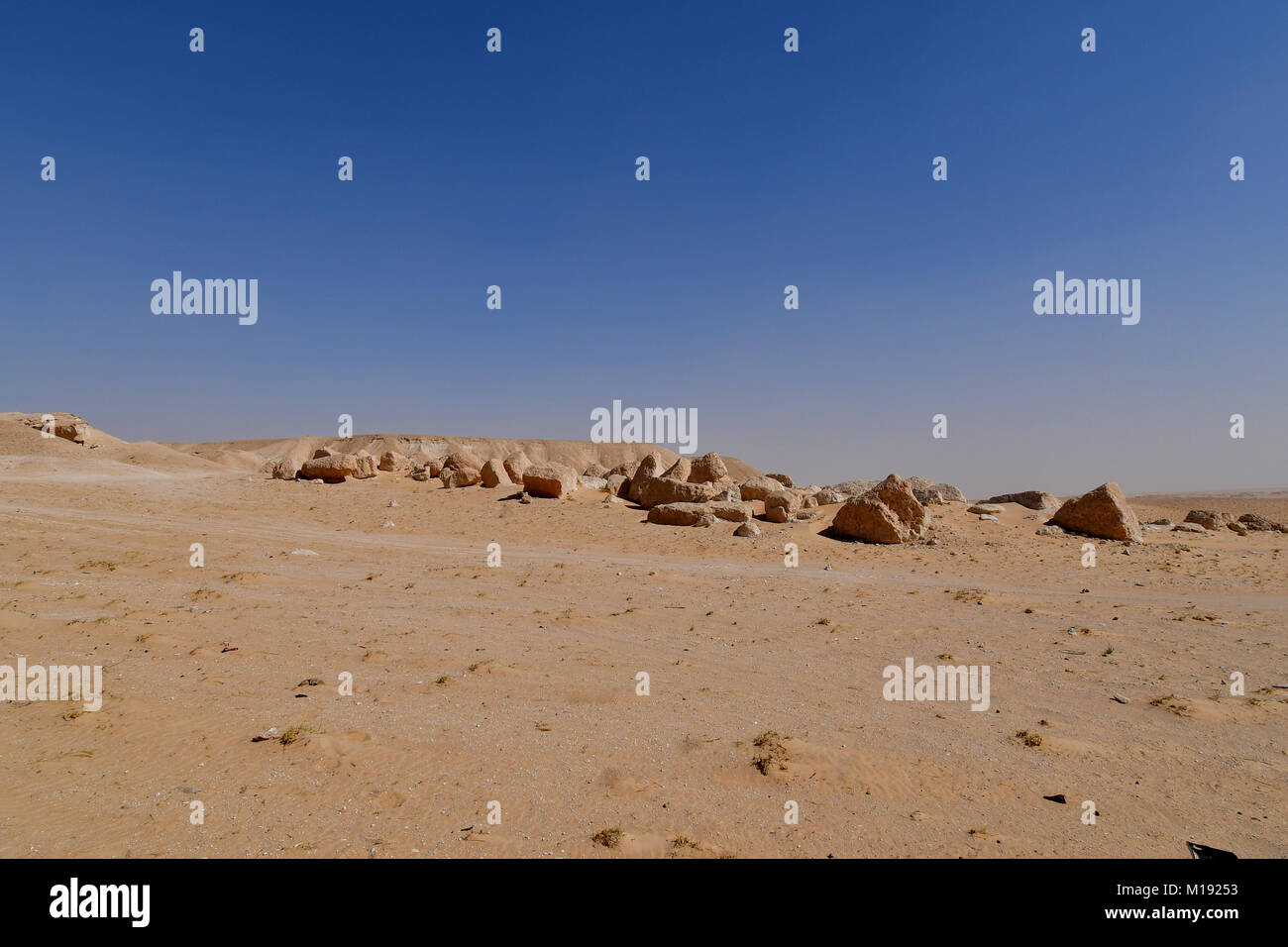 Desert scenery and landscape with desert sand and rocky formations ...