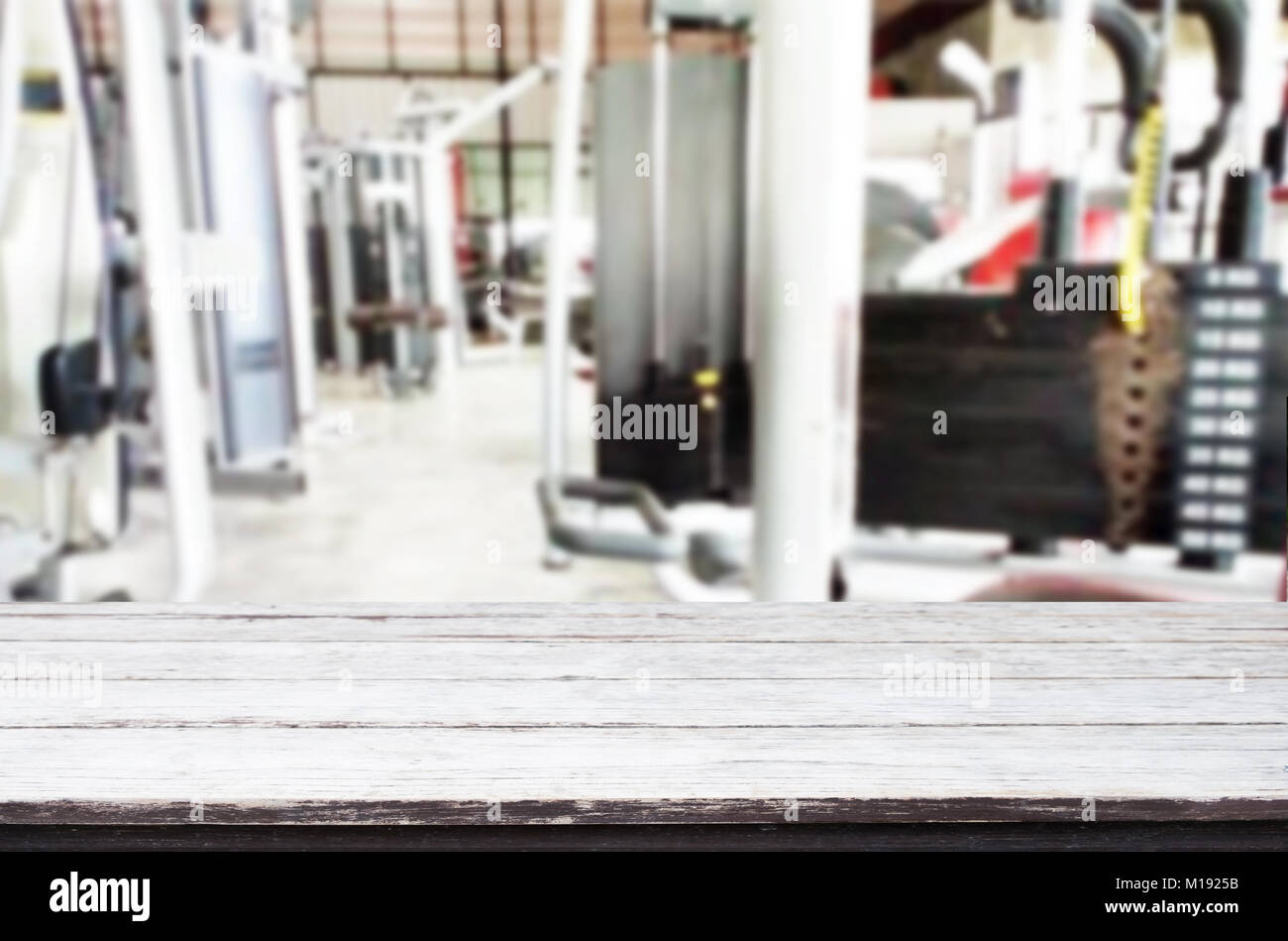 Wooden table on blurred background of fitness gym interior of modern ...