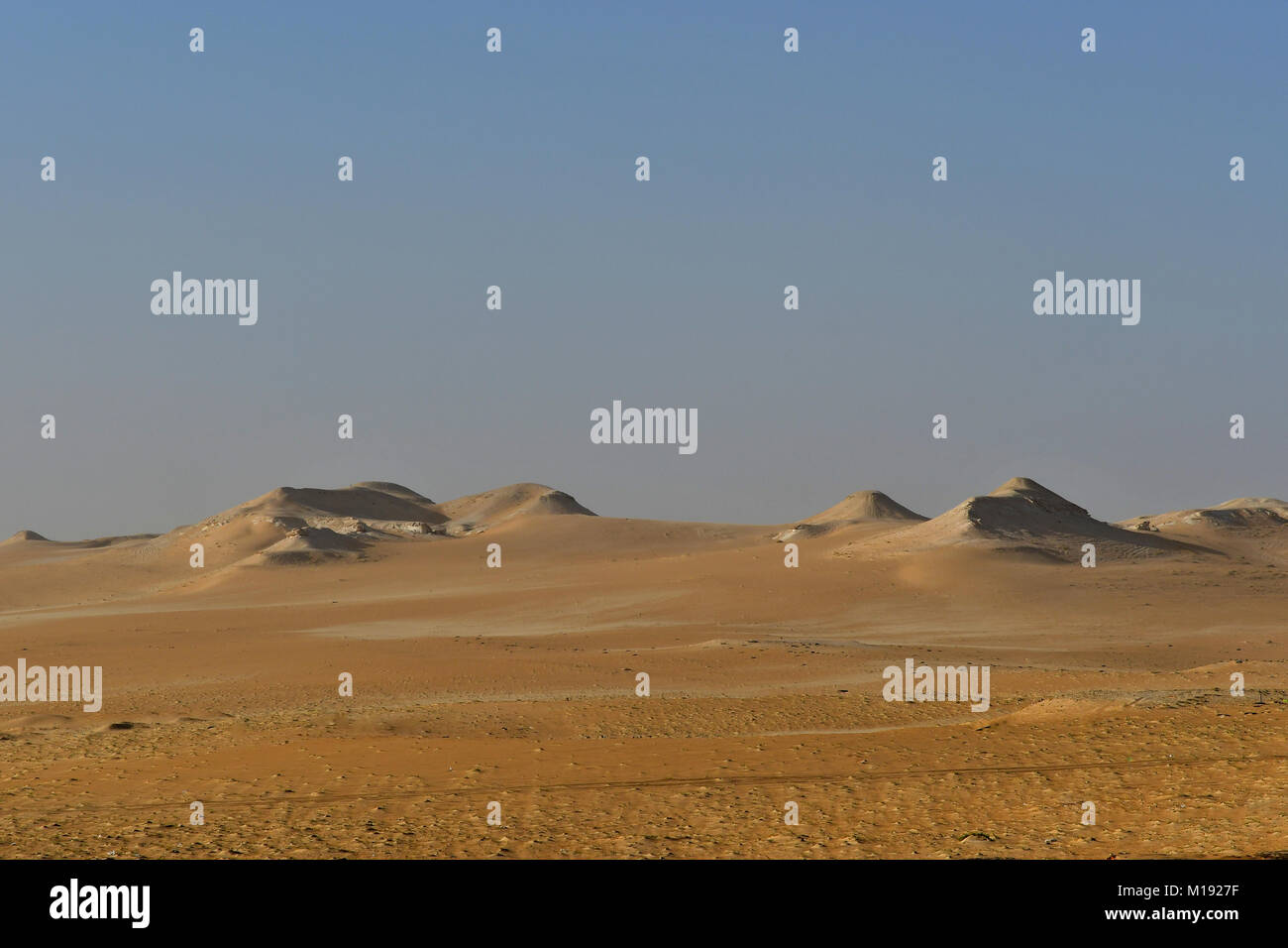 Desert scenery and landscape with desert sand and rocky formations ...