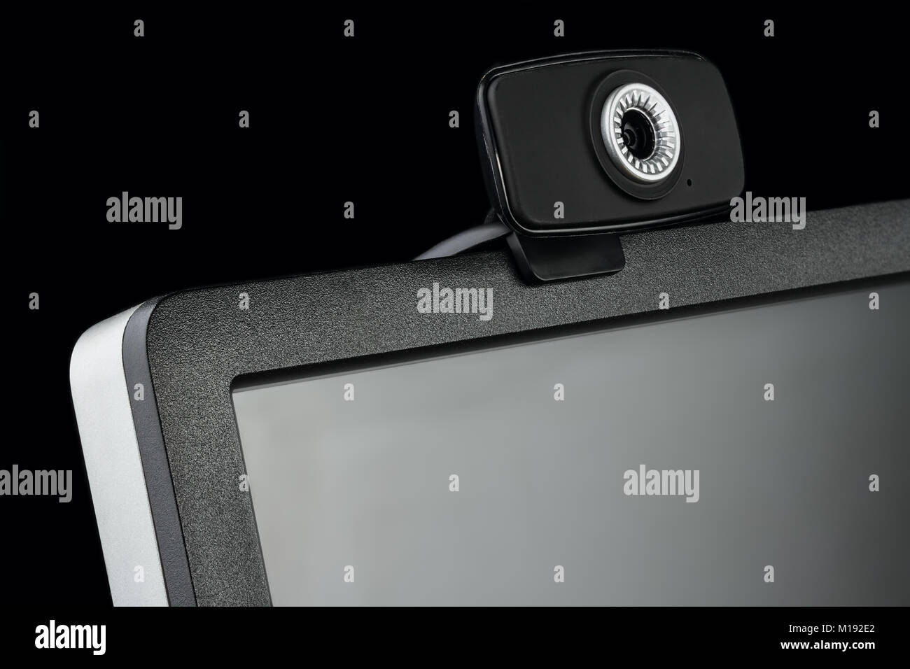 Digital black computer monitor screen and HD web camera on black ...