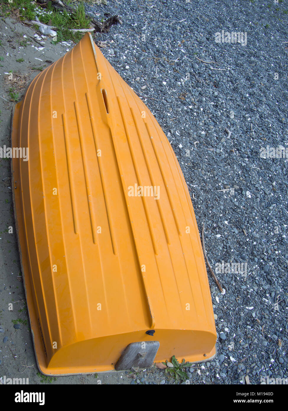 Small Orange Boat On The Beach Stock Photo - Alamy