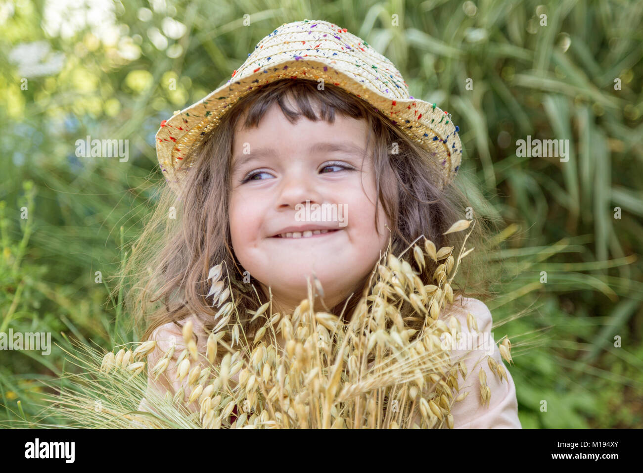 Girl playing on the flower field Stock Photo - Alamy