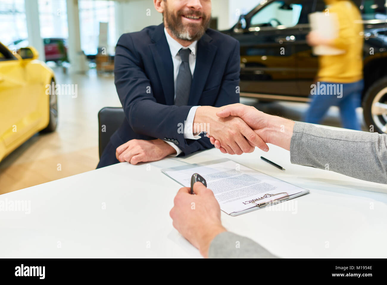 Business Deal in Car Showroom Stock Photo - Alamy