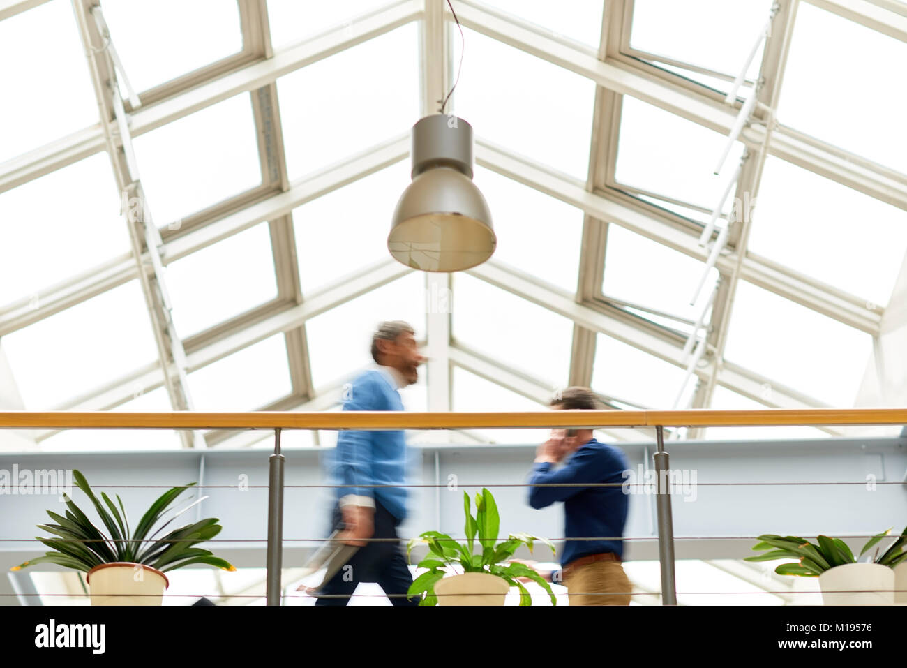 People Walking in Office Building Stock Photo - Alamy