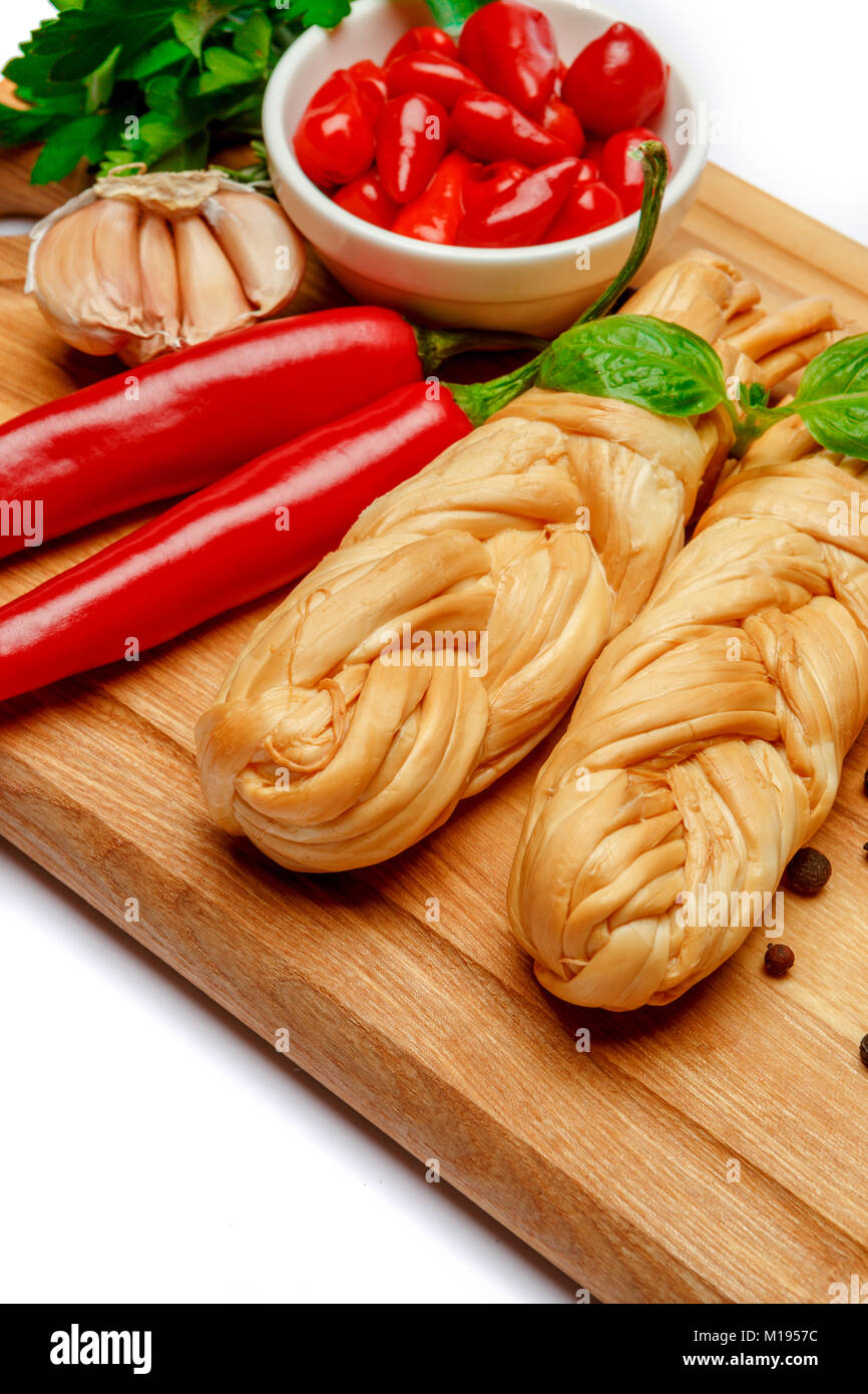 Smoked braided cheese and red pepper isolated on white background Stock ...