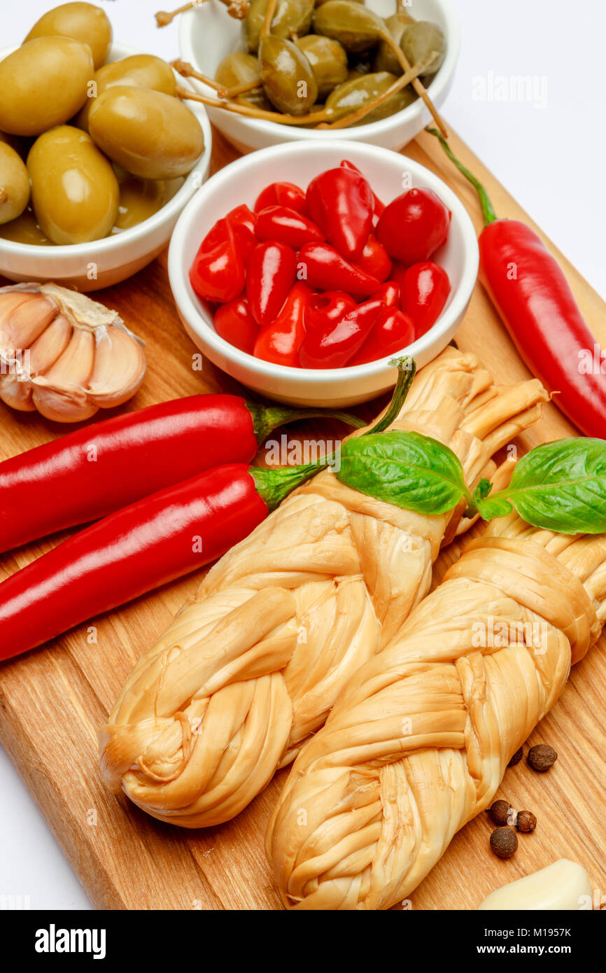 Smoked braided cheese and red pepper isolated on white background Stock ...