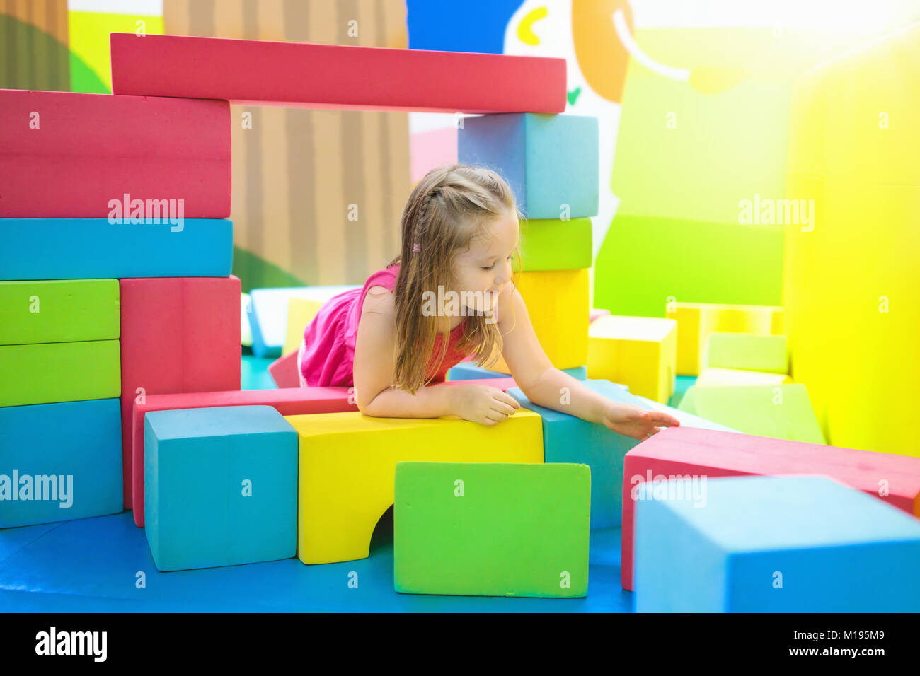 Child playing with colorful construction toy blocks. Educational toys ...