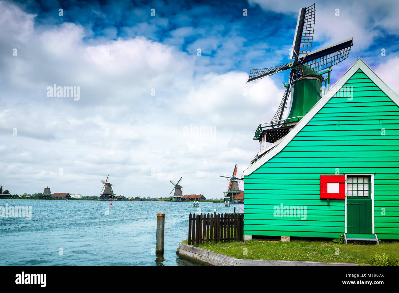 Dutch windmills and houses on the Zaans river from Zaanse Schans ...