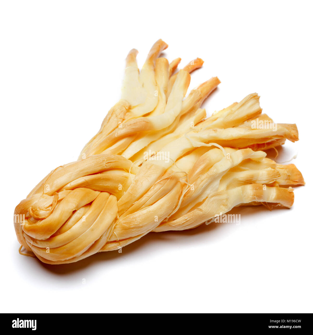 Smoked braided cheese isolated on white background Stock Photo - Alamy