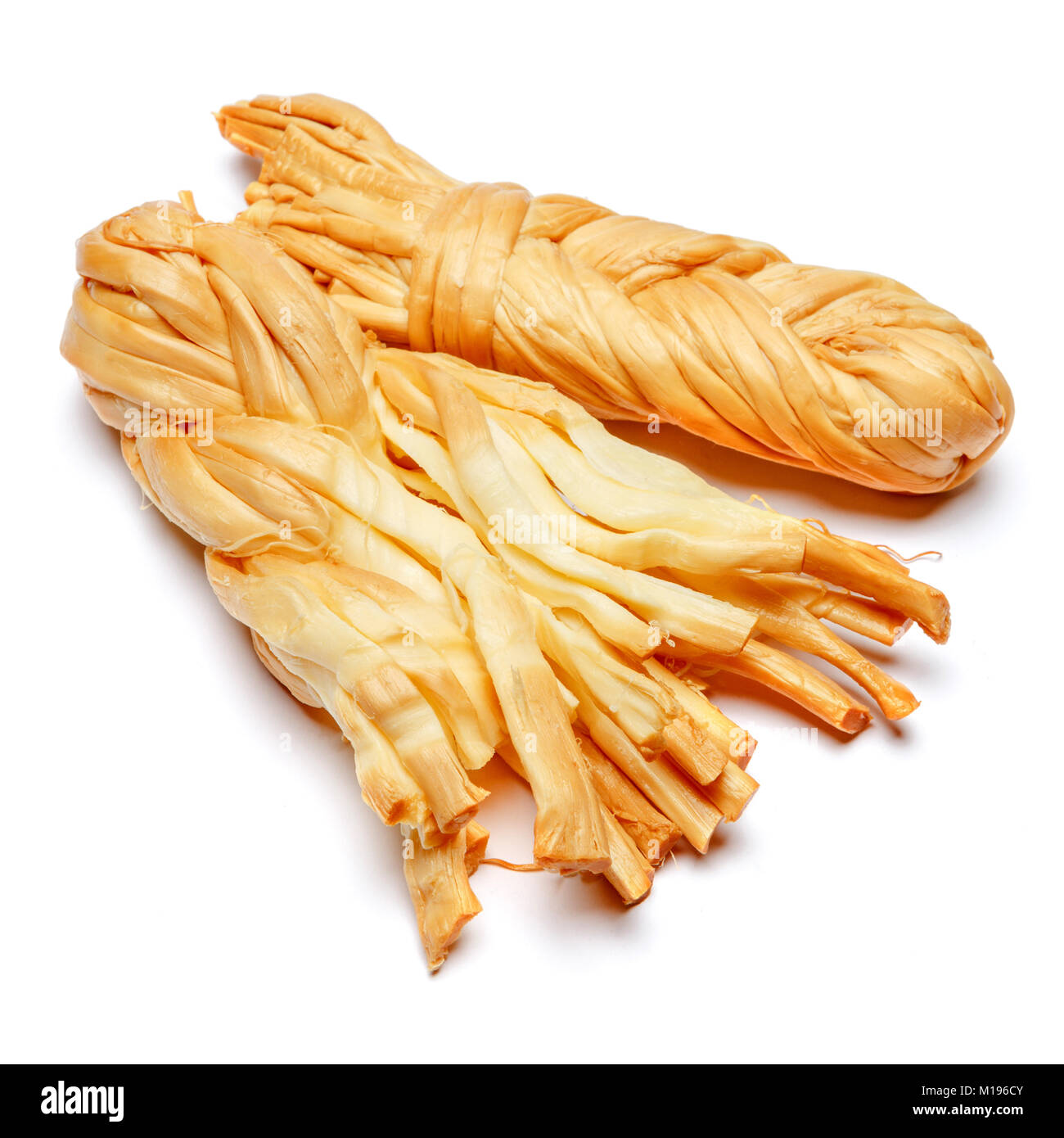 Smoked braided cheese isolated on white background Stock Photo - Alamy