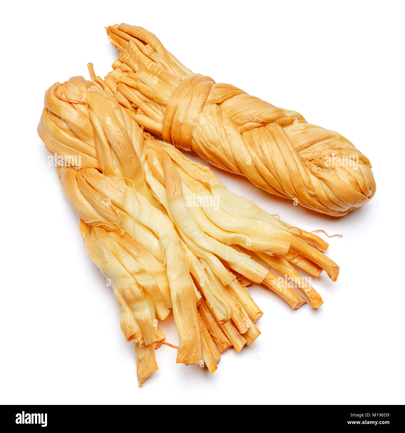 Smoked braided cheese isolated on white background Stock Photo - Alamy