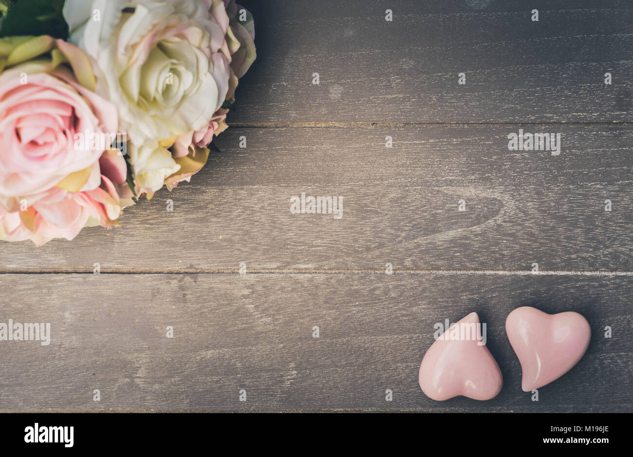 Two pink hearts and roses for Valentines Day with copy space on gray ...