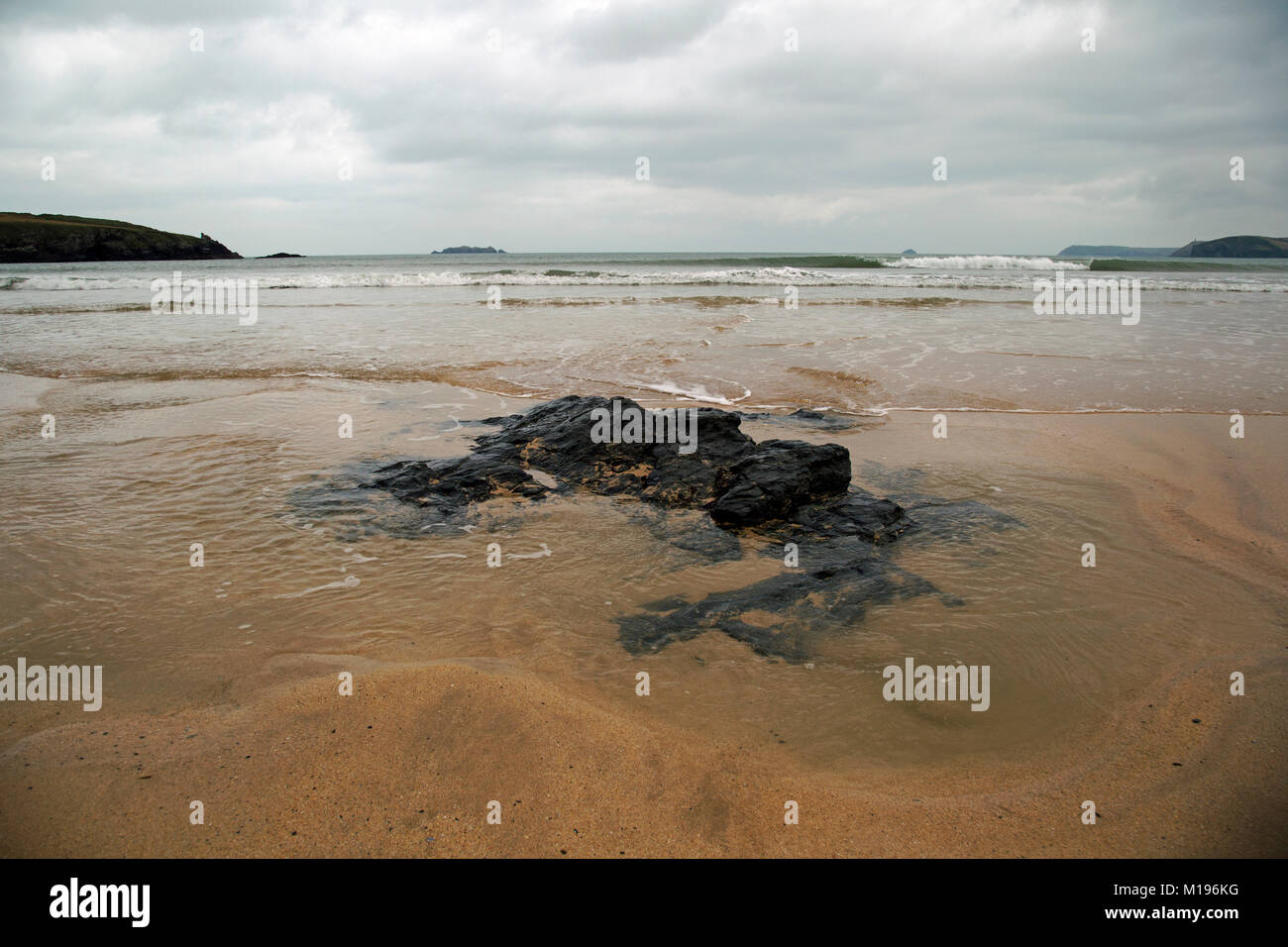 A winter beach scene at Harlyn, Cornwall showing a mix of rocks and ...