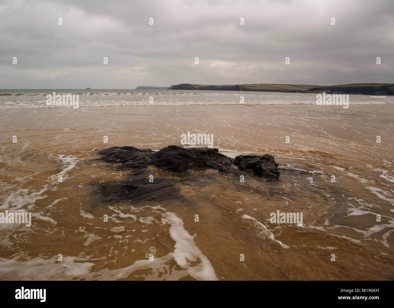 A winter beach scene at Harlyn, Cornwall showing a mix of rocks and ...