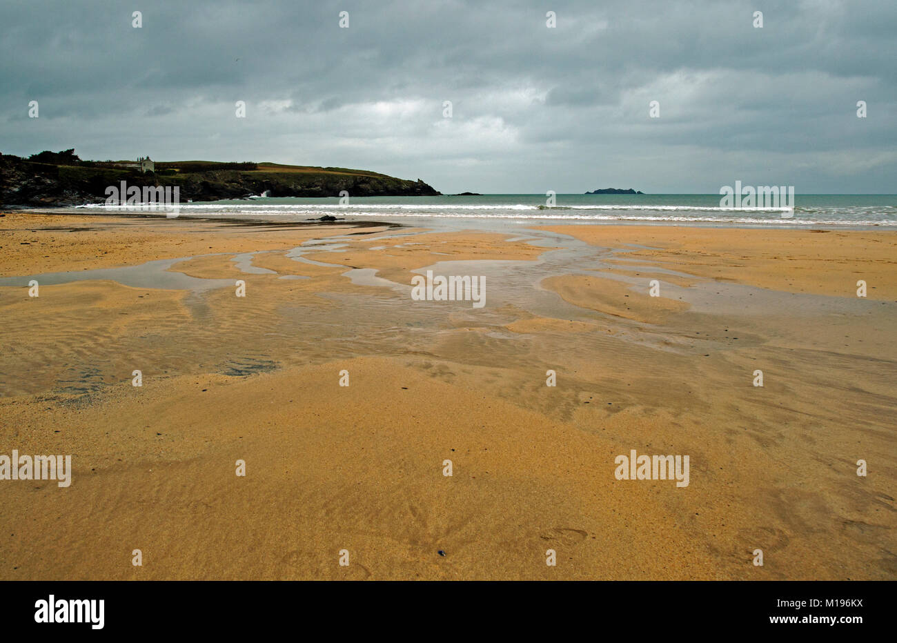 A winter beach scene at Harlyn, Cornwall showing a mix of rocks and ...
