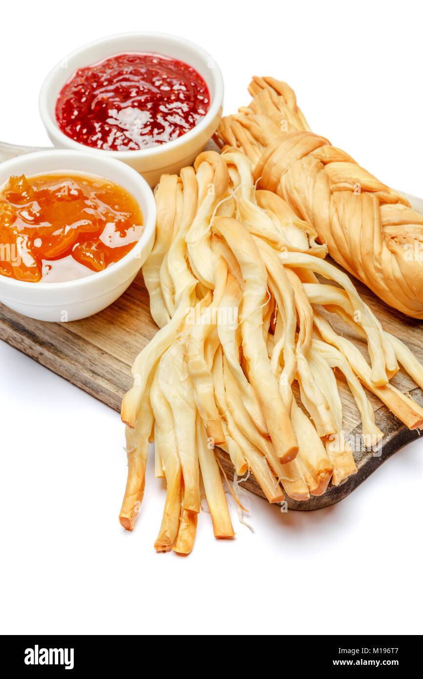 Smoked braided cheese isolated on white background Stock Photo - Alamy