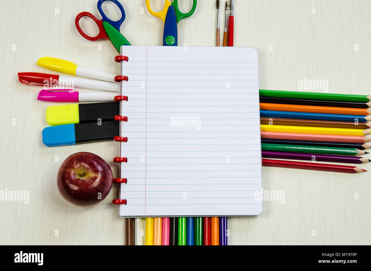 school office supplies around paper notepad Stock Photo - Alamy