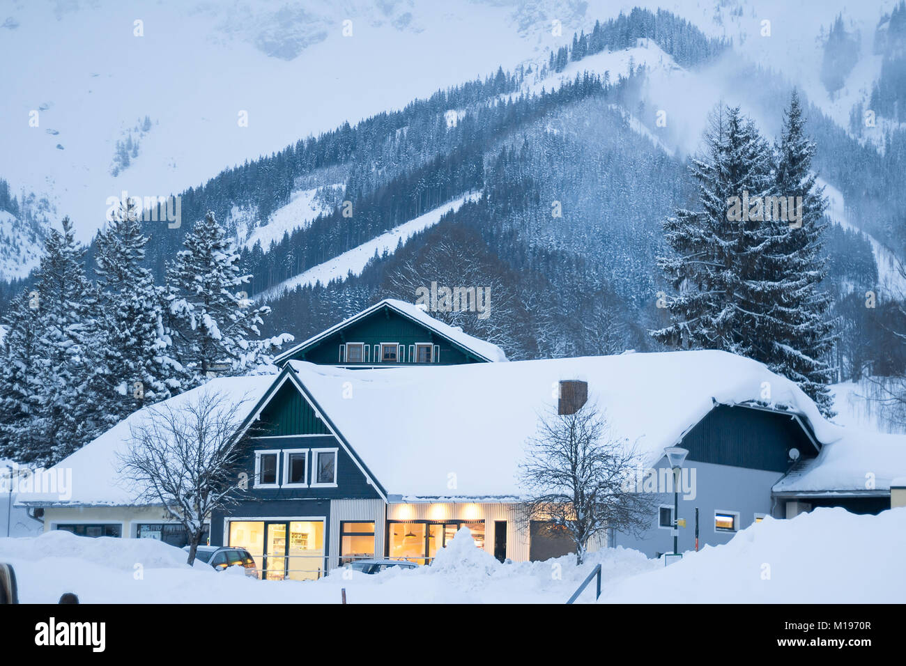 snow covered house under mountain Stock Photo - Alamy