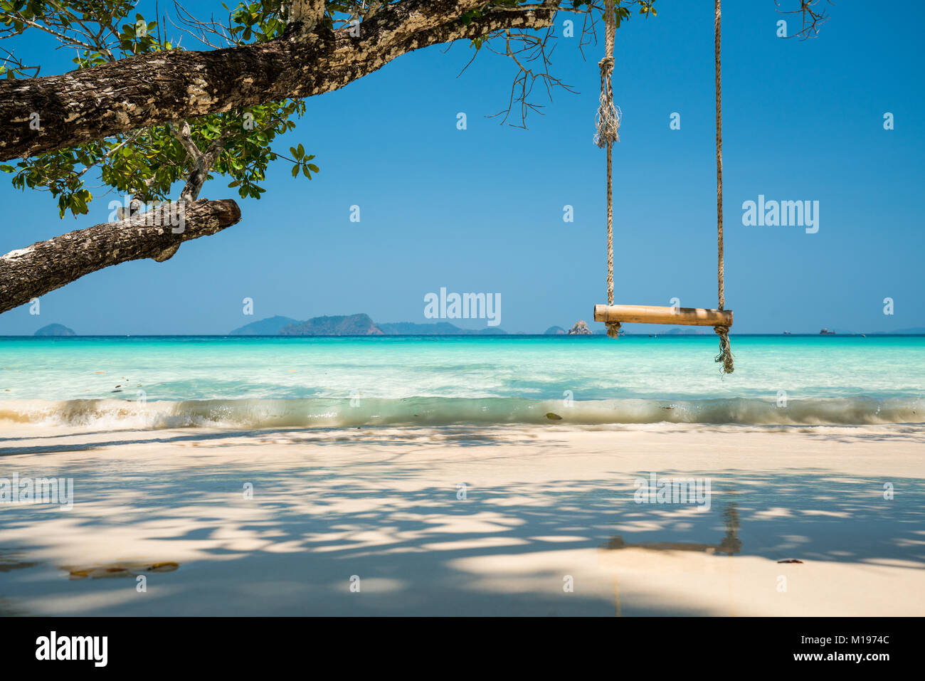 swing hang on big tree over beach sea background, Nyaung Oo Phee ...