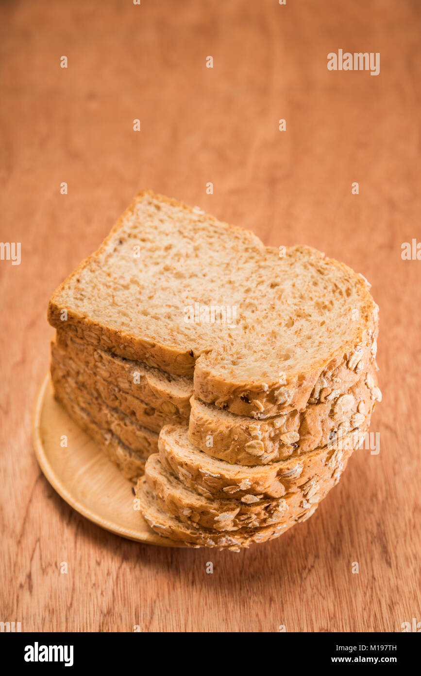 whole wheat bread, bio ingredients, very healthy on wood table Stock ...