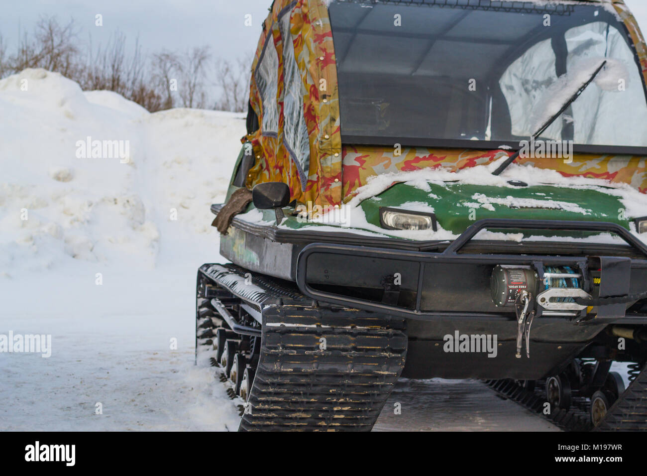 ATV to snow machine for winter snow sports Stock Photo - Alamy