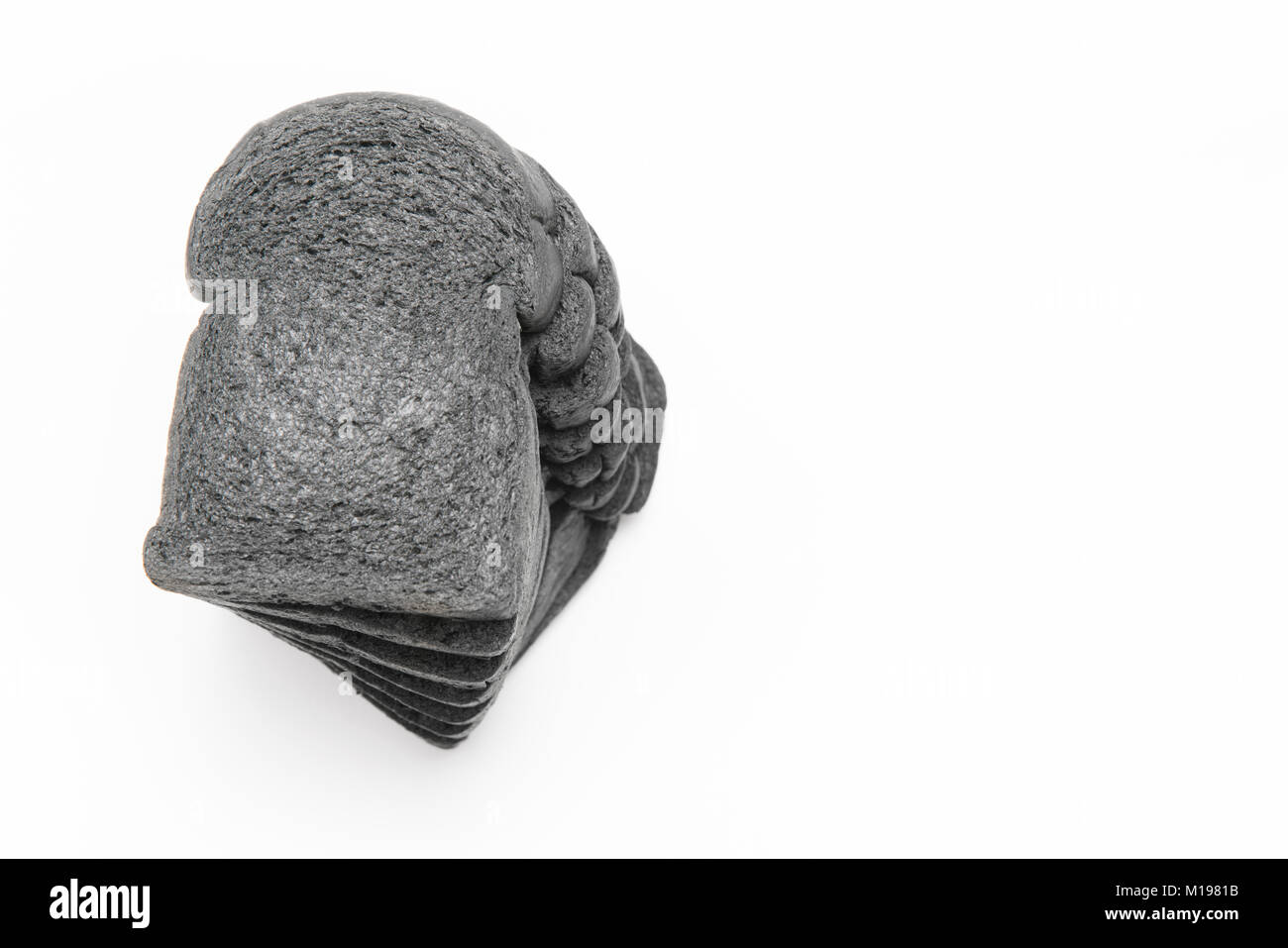 loaf slide of charcoal bread black bread isolated on white background ...