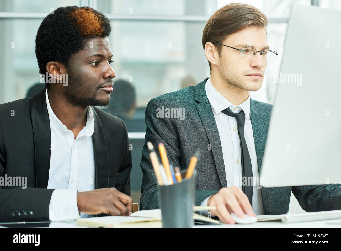 Young Professionals Using PC Stock Photo - Alamy
