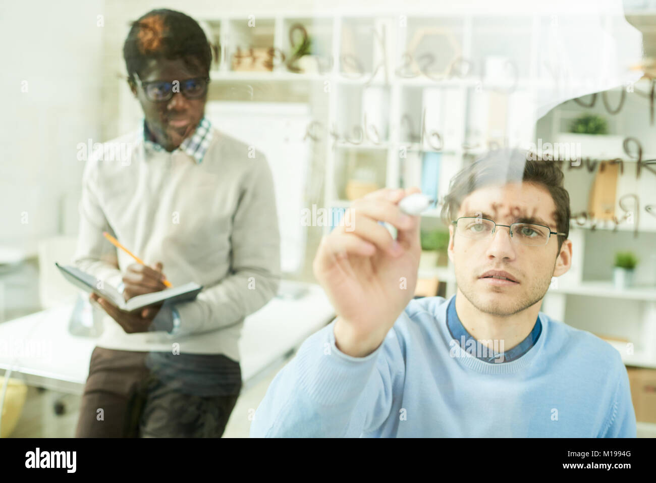 People writing glass wall hi-res stock photography and images - Alamy