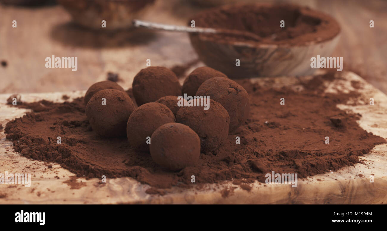 handmade truffles in cocoa powder on board Stock Photo - Alamy