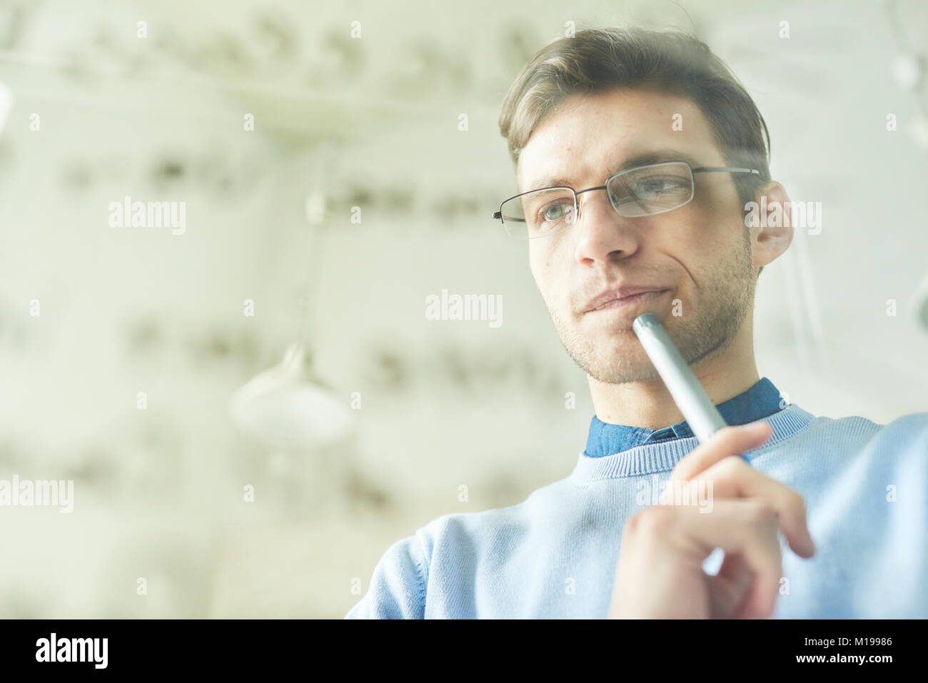 IT Professional Thinking over Code Stock Photo - Alamy