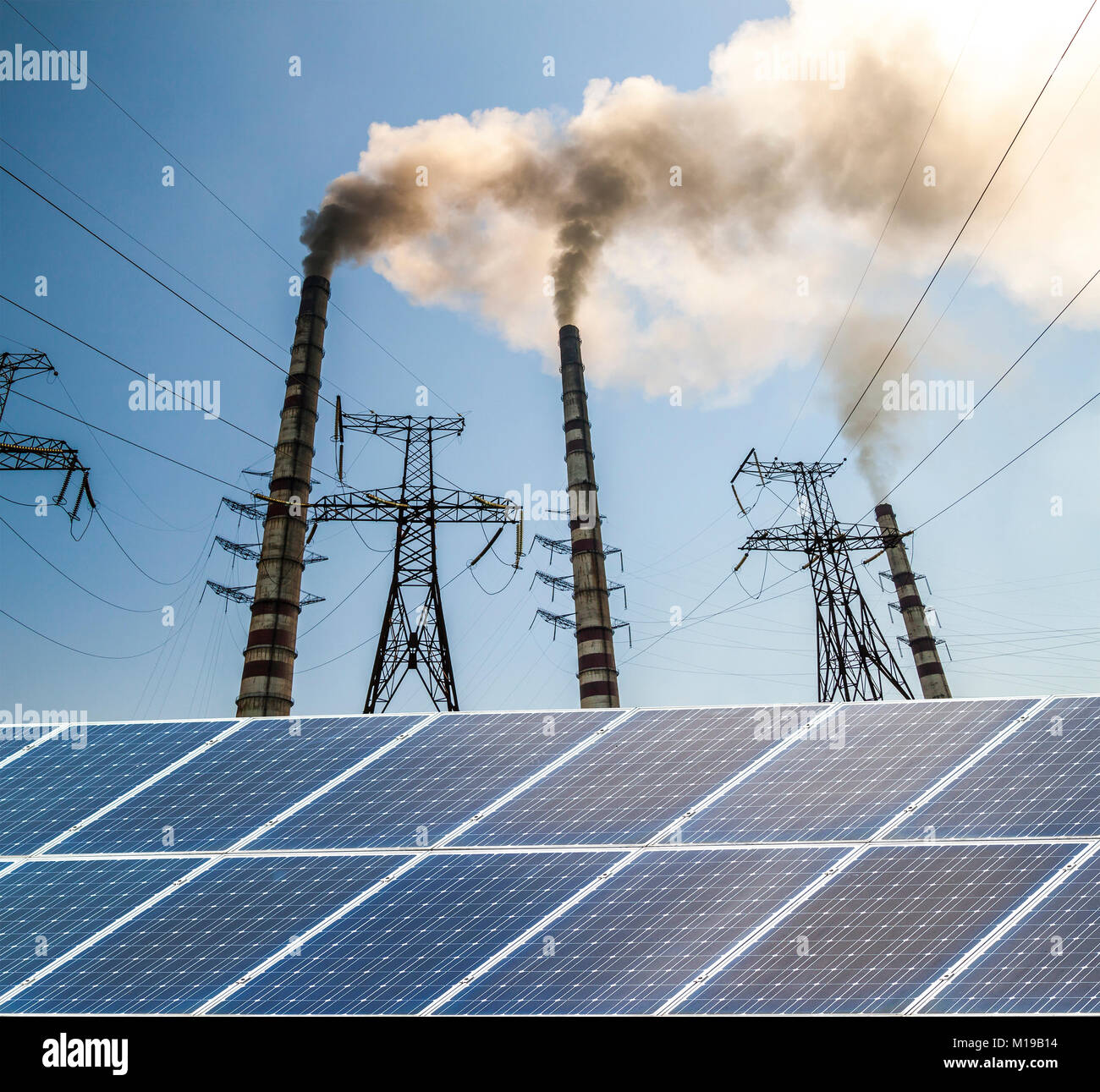 Solar panels against fuel coal power plant. Sustainable development and ...