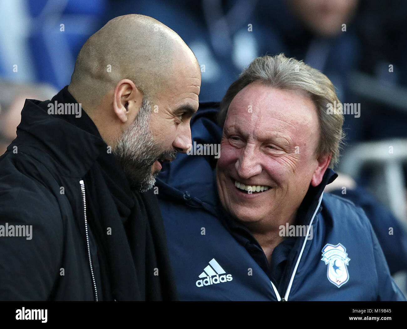 Manchester City manager Pep Guardiola (left) and Cardiff City manager ...