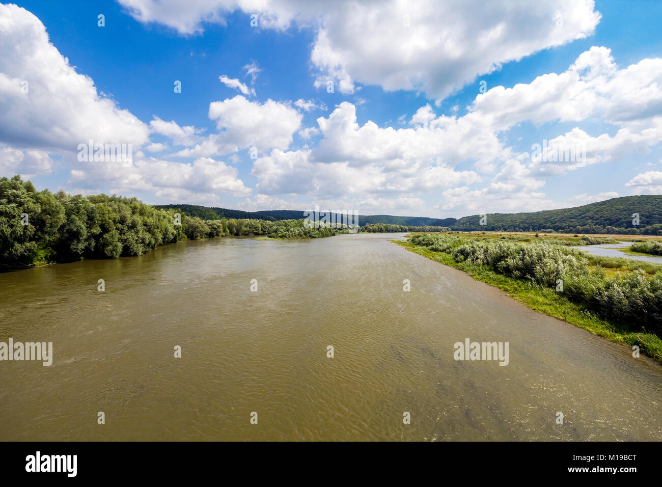 Water in wide river in summer with green trees on the banks Stock Photo ...