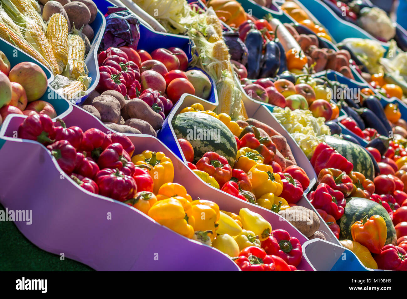 Farmers fruit market with various colorful fresh fruits and vegetables ...