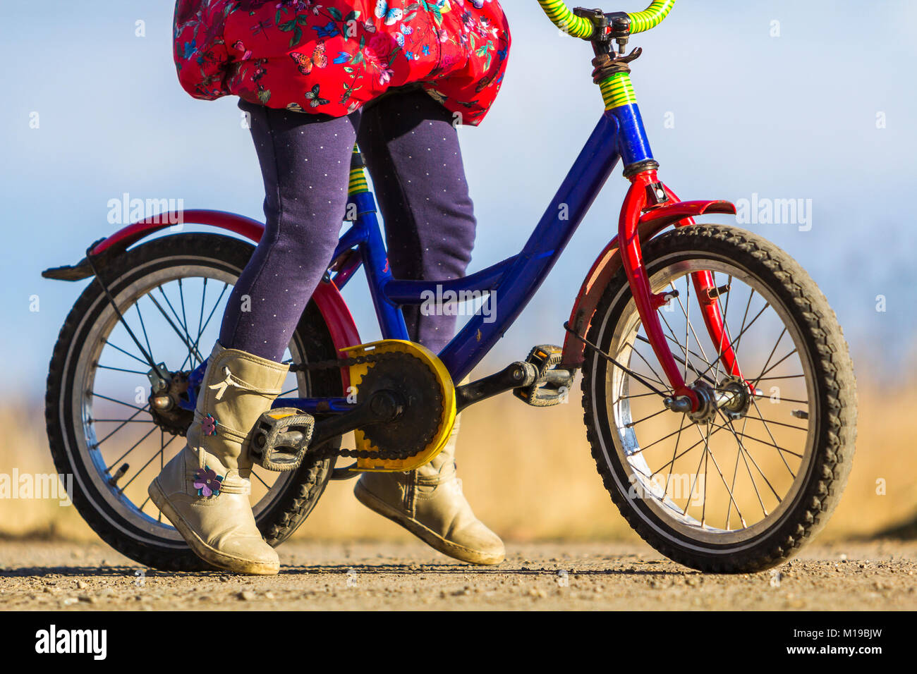 Close-up detail of little girl child feet on a child bicycle Stock ...
