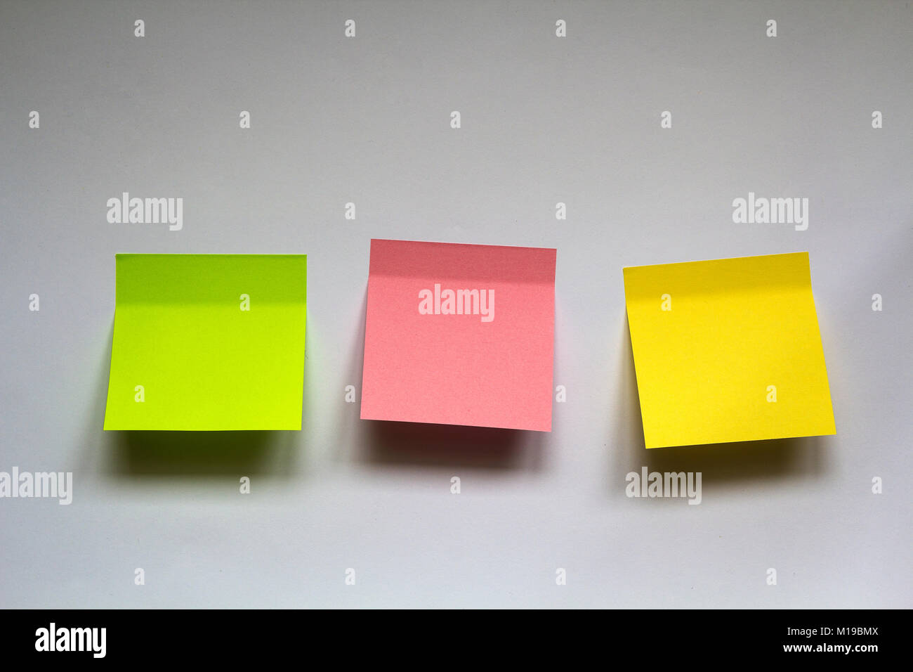 Blank colorful sticky notes isolated on white wall background Stock ...