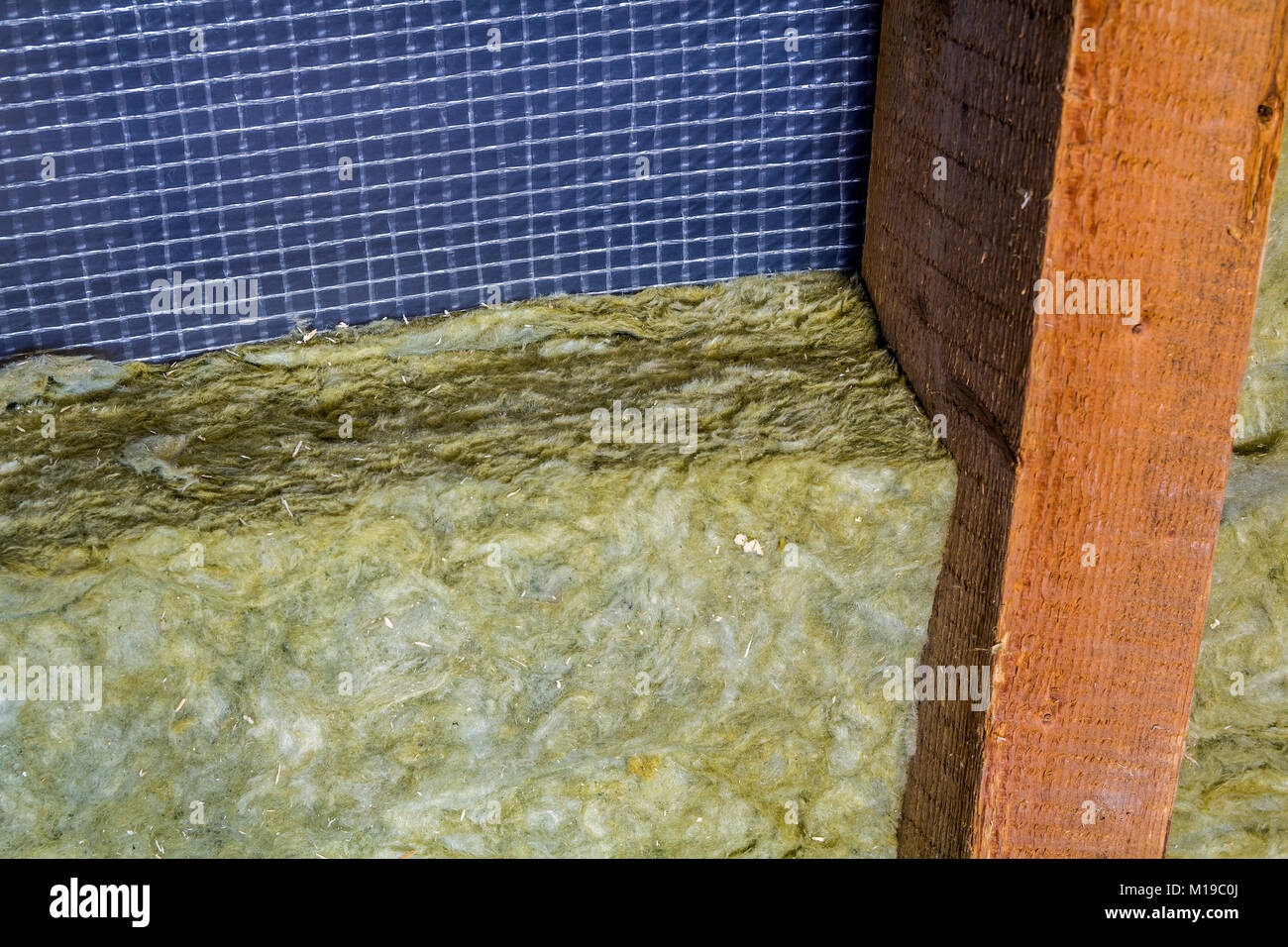 Thermal insulation mineral rock wool installation at the new building ...