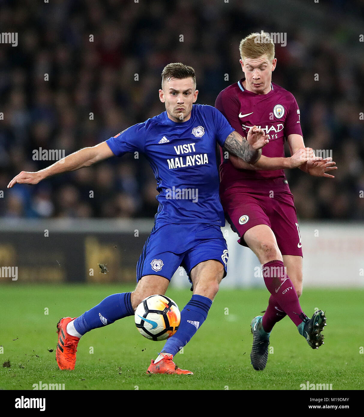 Cardiff City's Joe Ralls (left) and Manchester City's Kevin De Bruyne ...