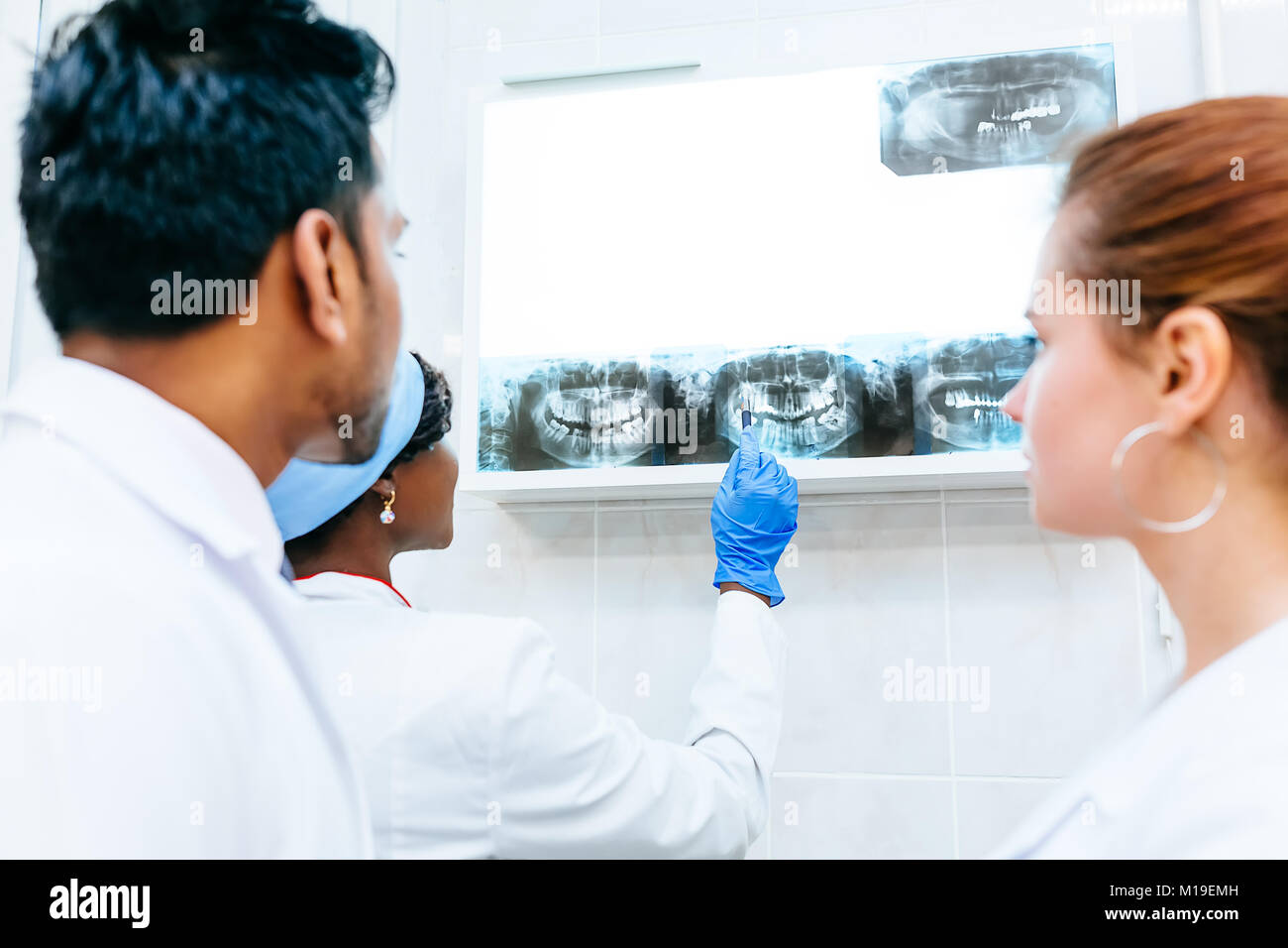 dental team checking teeth x ray of patient Stock Photo - Alamy