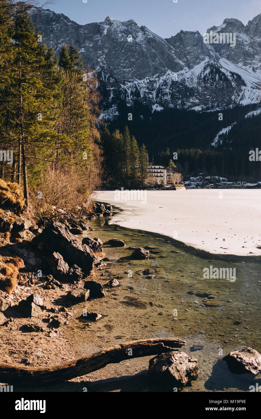 Forest and shore at Bavarian landmark Lake Eibsee, Zugspitze mountain ...