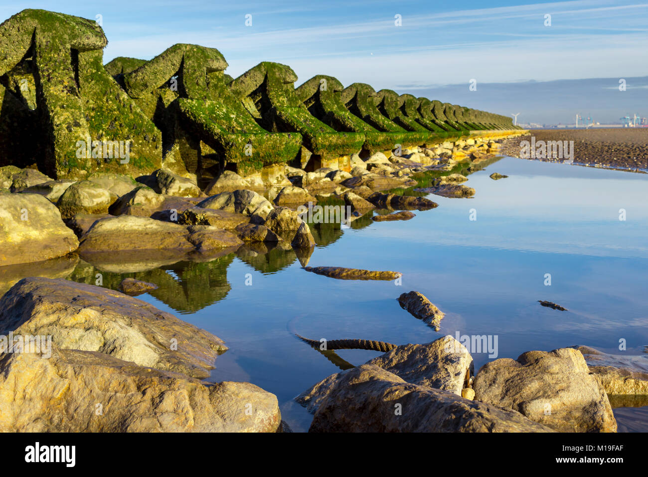New Brighton beach wave breakers and sea defence system Stock Photo - Alamy
