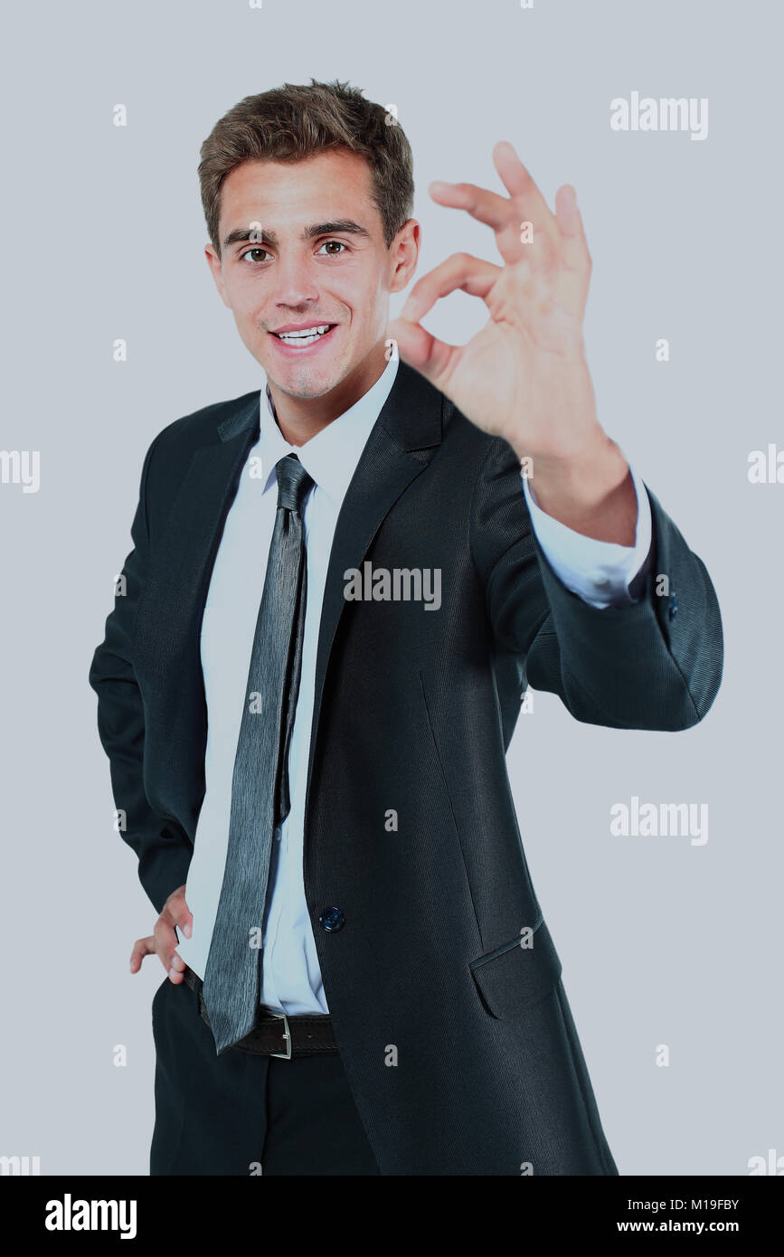 Business man shows well done against different backgrounds Stock Photo ...