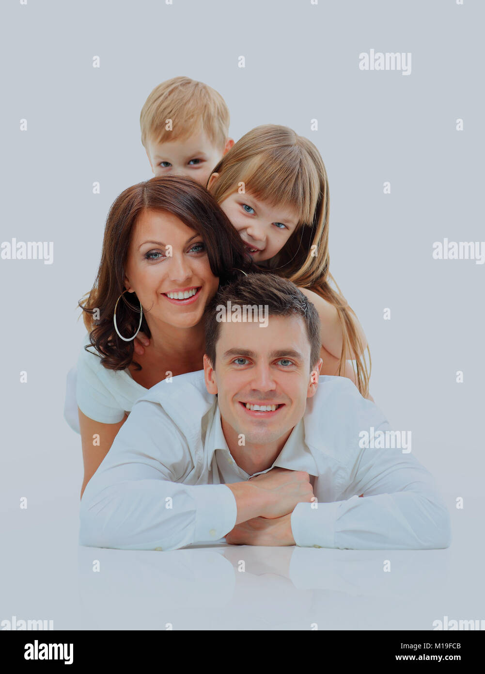 Happy family smiling. Isolated over a white background Stock Photo - Alamy