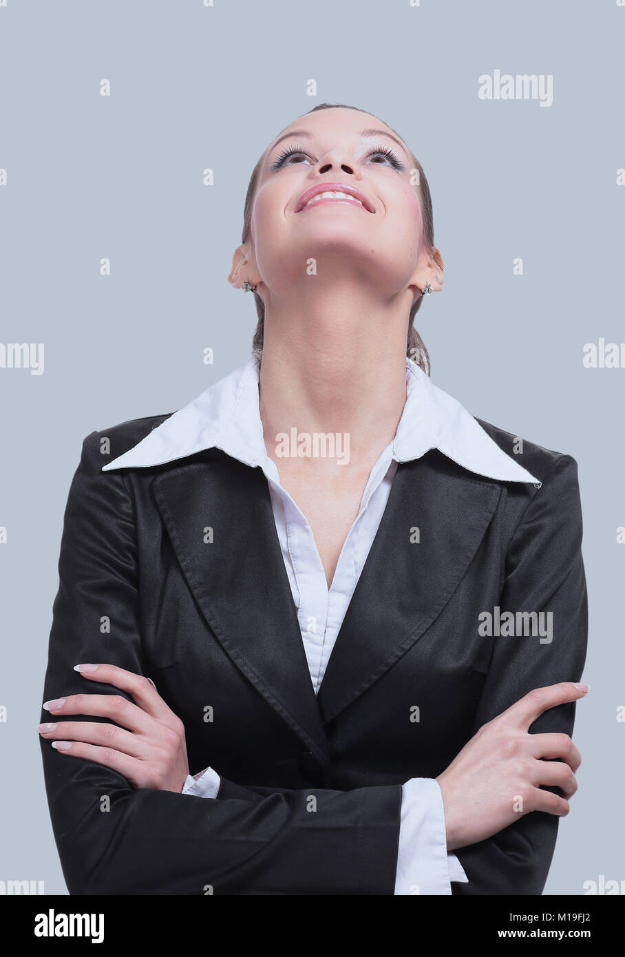 Beautiful young business woman looking up isolated Stock Photo - Alamy