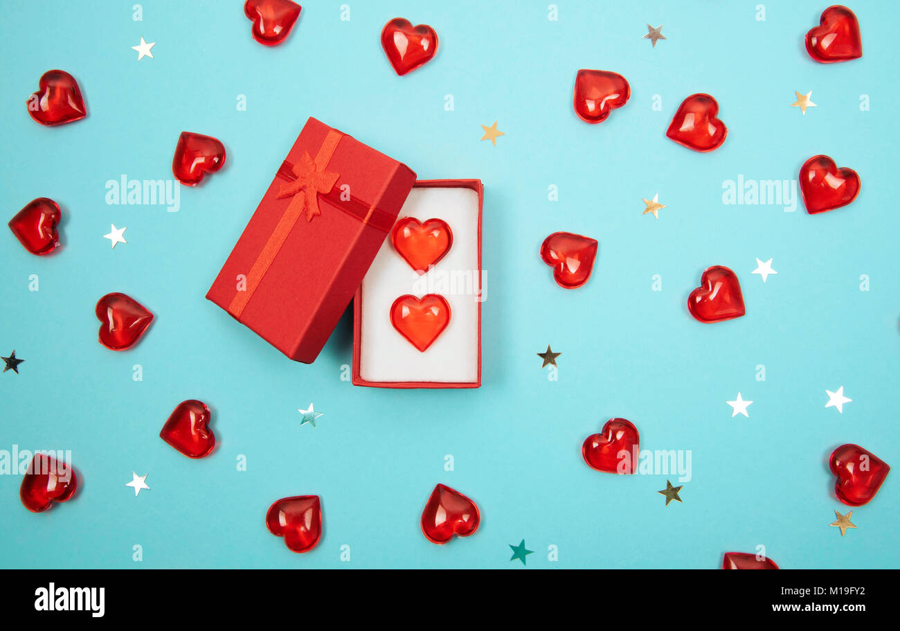 Red heart against blue background Stock Photo - Alamy