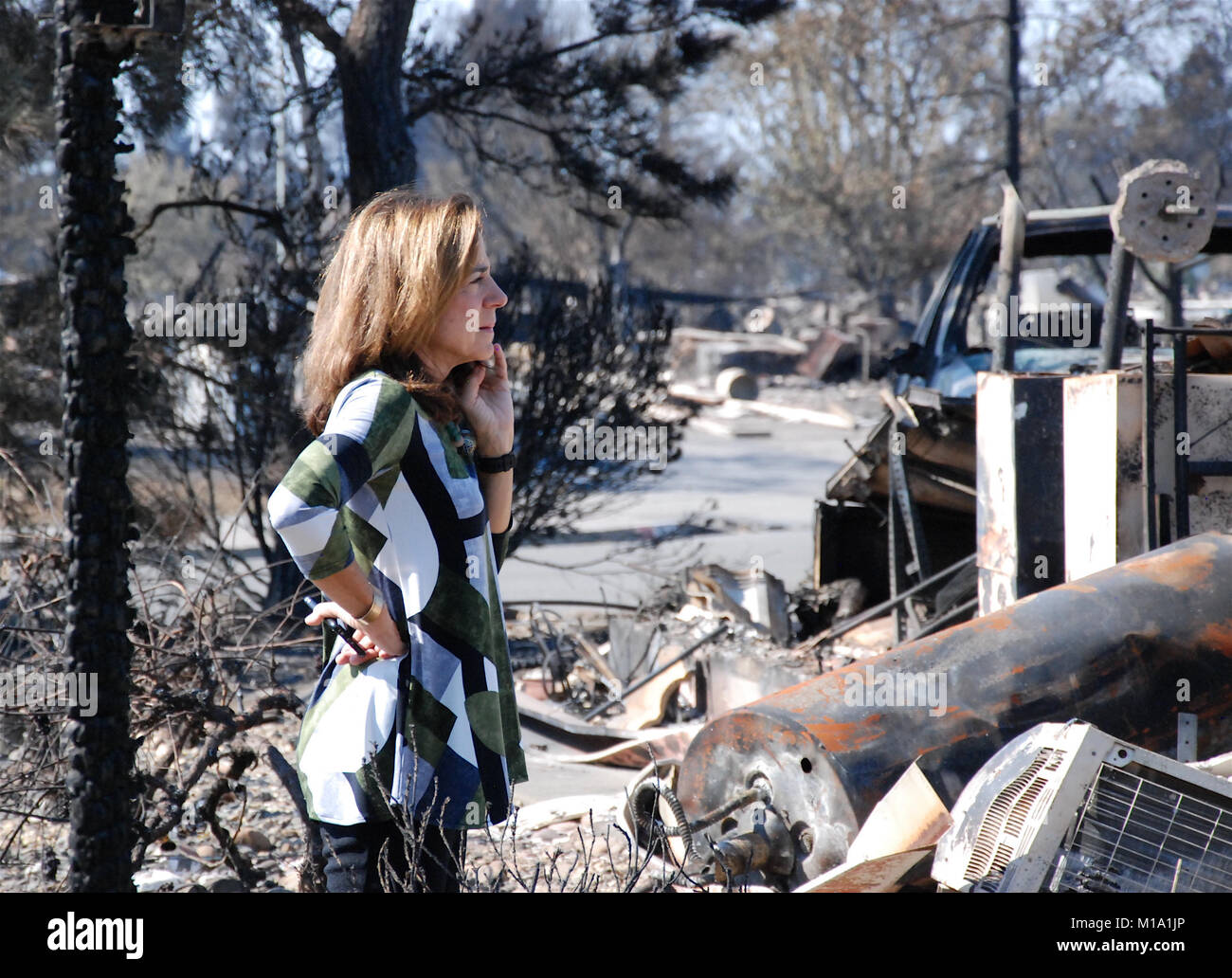 California First Lady Anne Bust Brown surveys the damage caused by the ...